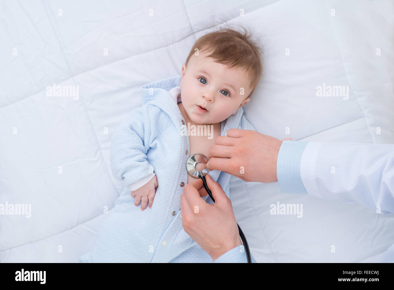 Professional pediatrician examining infant Stock Photo - Alamy