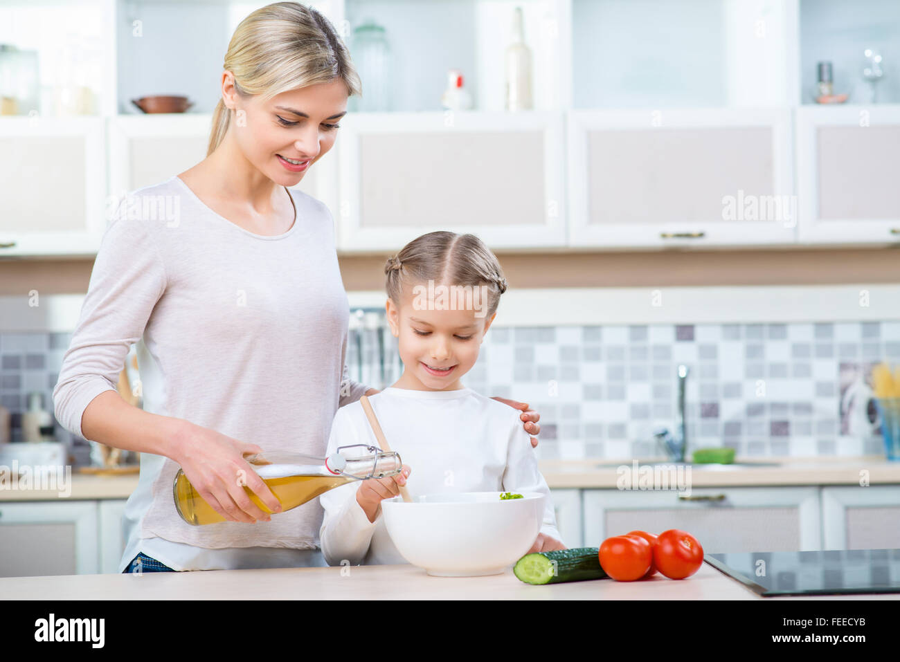 Mother and her daughter cooking in the kitchen Stock Photo - Alamy