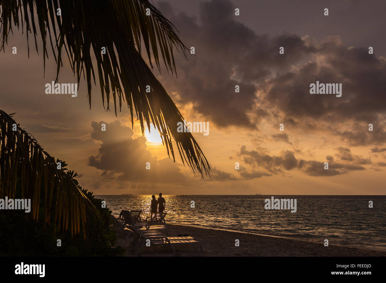 Sunset ocean beach view from the tropical island resort, at the ...