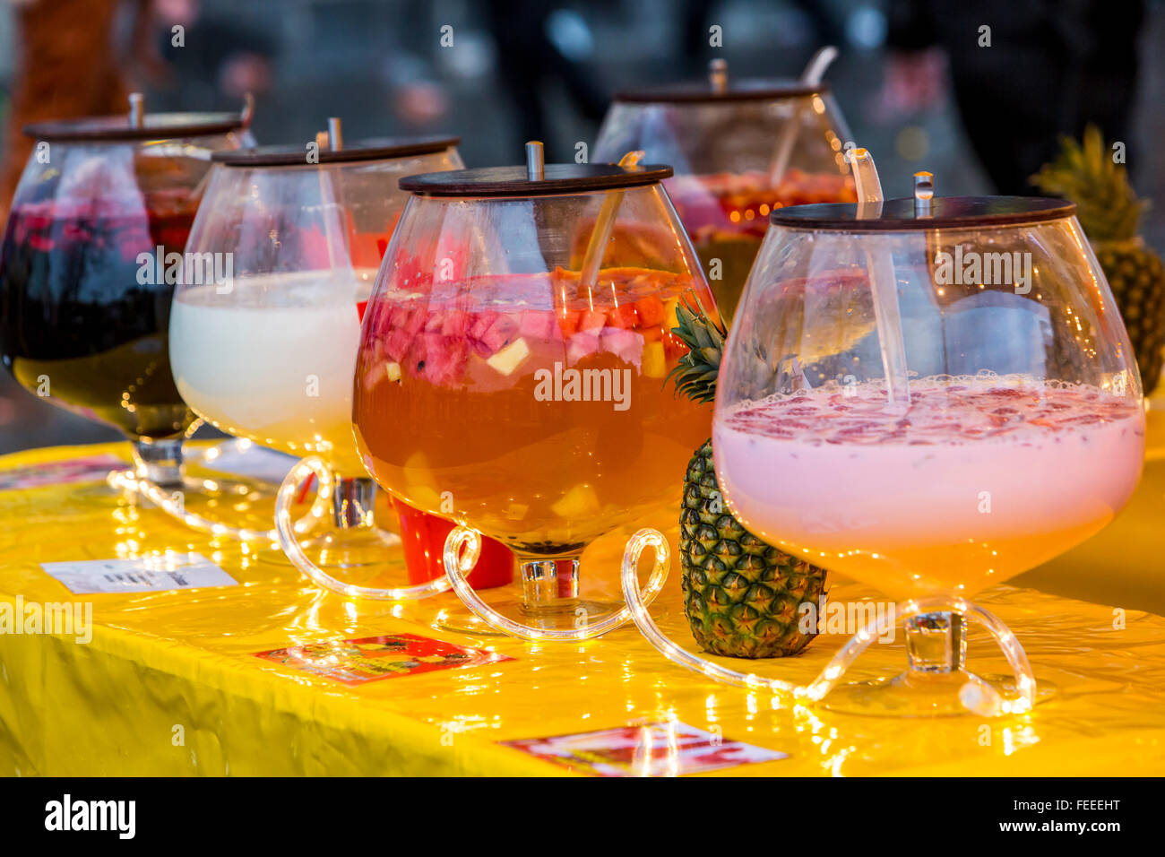 Carnival, booth with alcoholic mix drinks, big bowls with fruit and ...