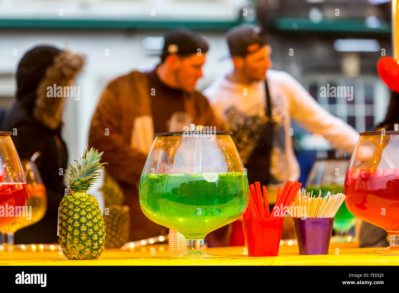 Carnival, booth with alcoholic mix drinks, big bowls with fruit and ...