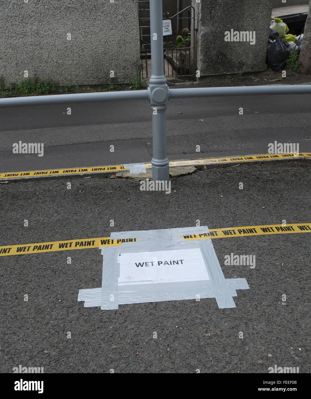Wet paint signs by rails in Cheddar near the gorge Stock Photo - Alamy