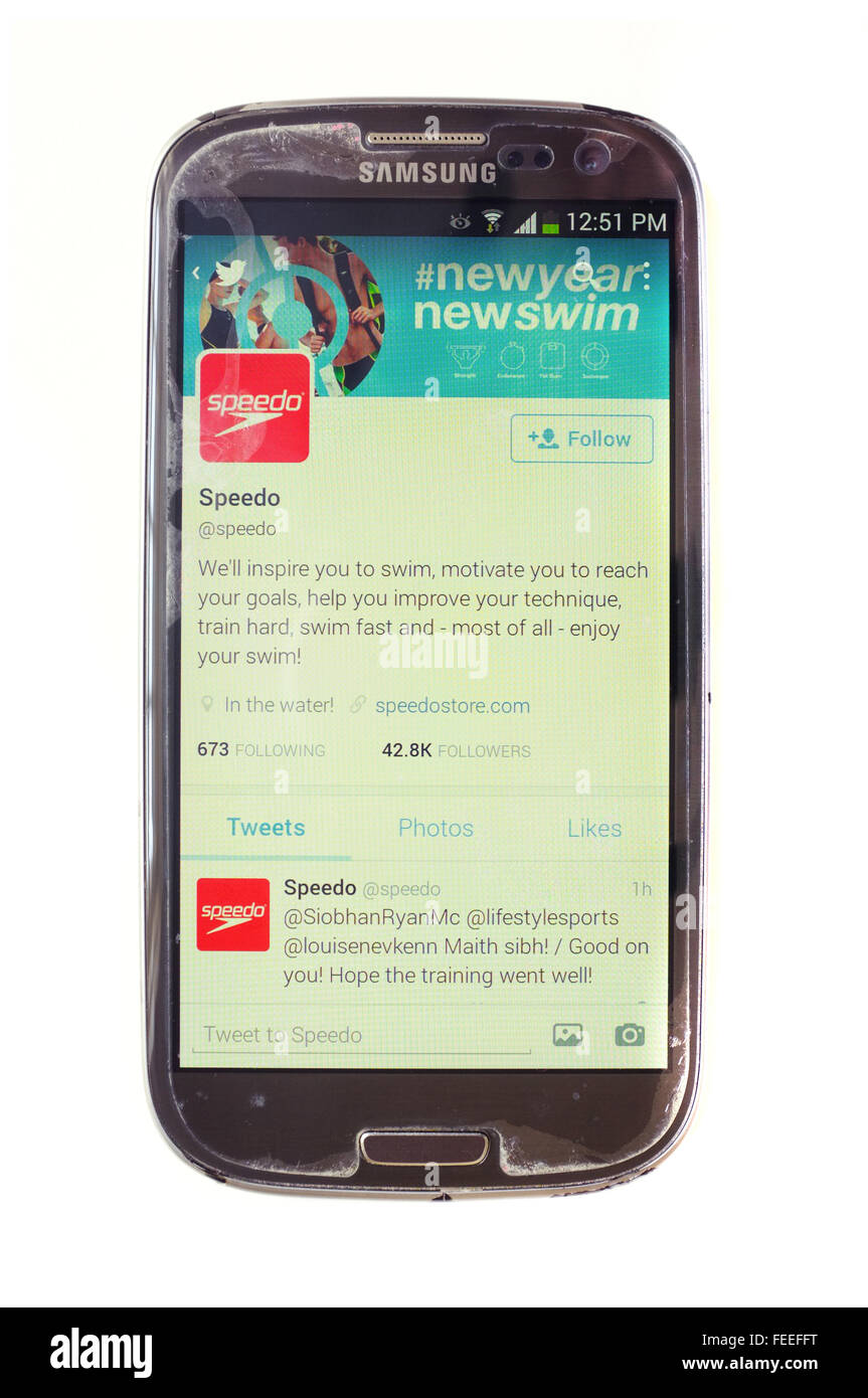 The Speedo Twitter page on a smartphone screen photographed against a ...
