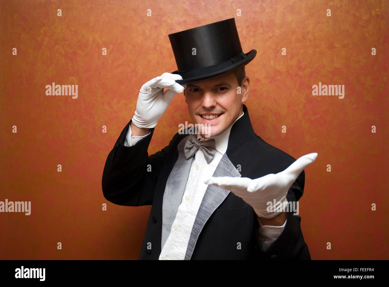 Magician performing a magic trick Stock Photo - Alamy