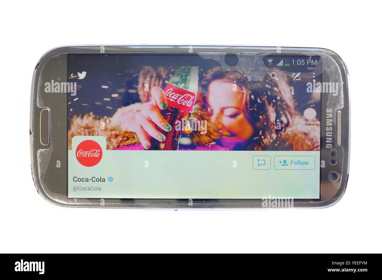 The Coca Cola Twitter account on the screen of a smartphone ...