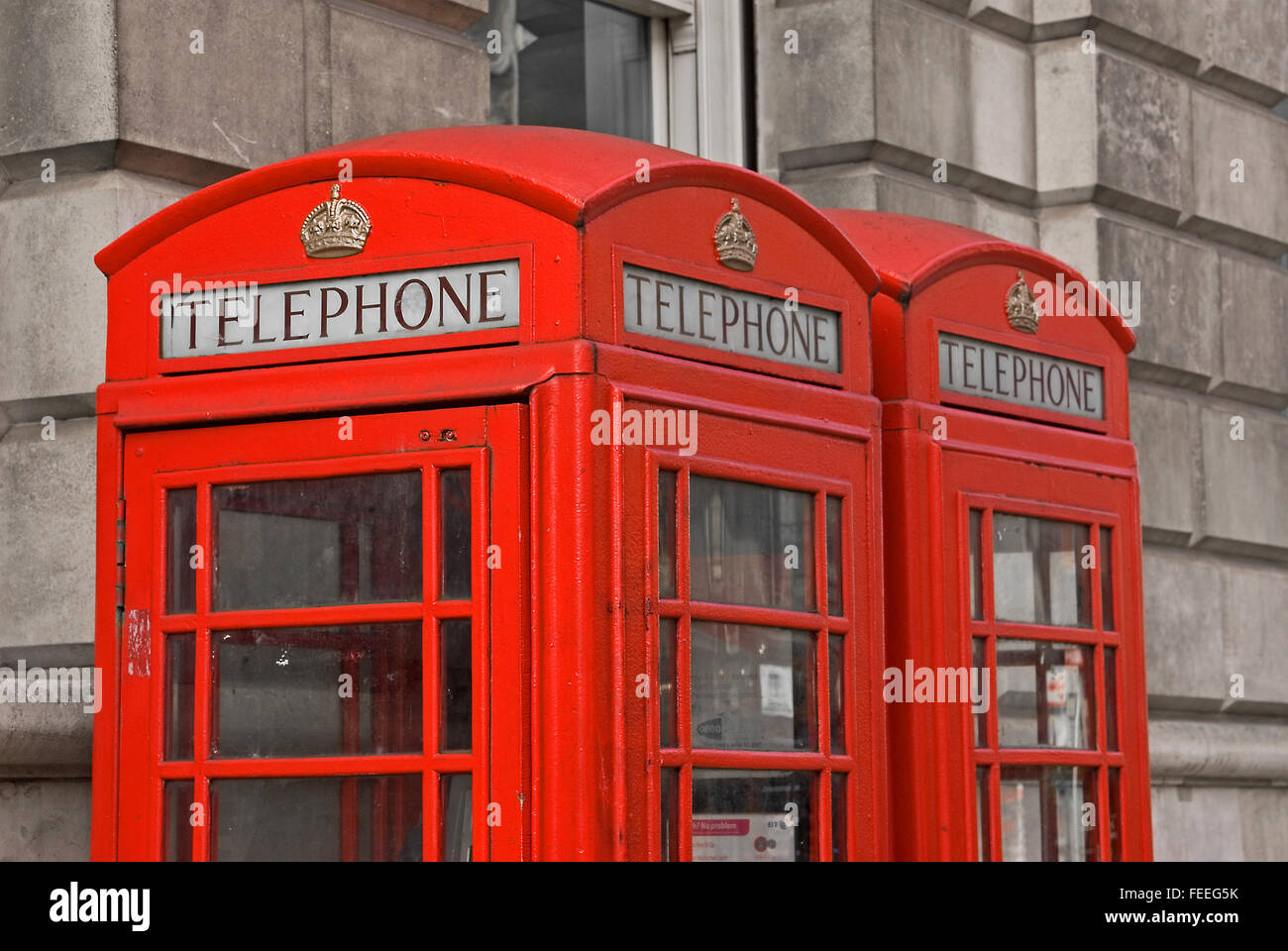 Pair of iconic red telephone boxes or kiosks, stand on Whitehall in ...
