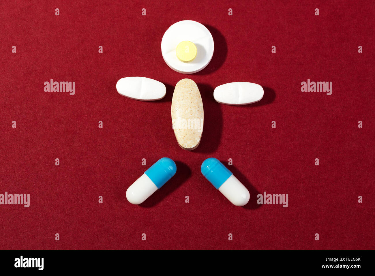 cure capsule on a red paper background Stock Photo - Alamy