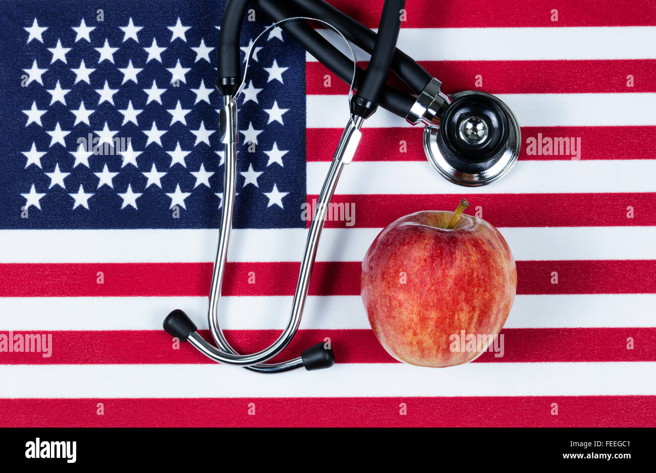 United States of America flag with stethoscope and red apple. USA ...