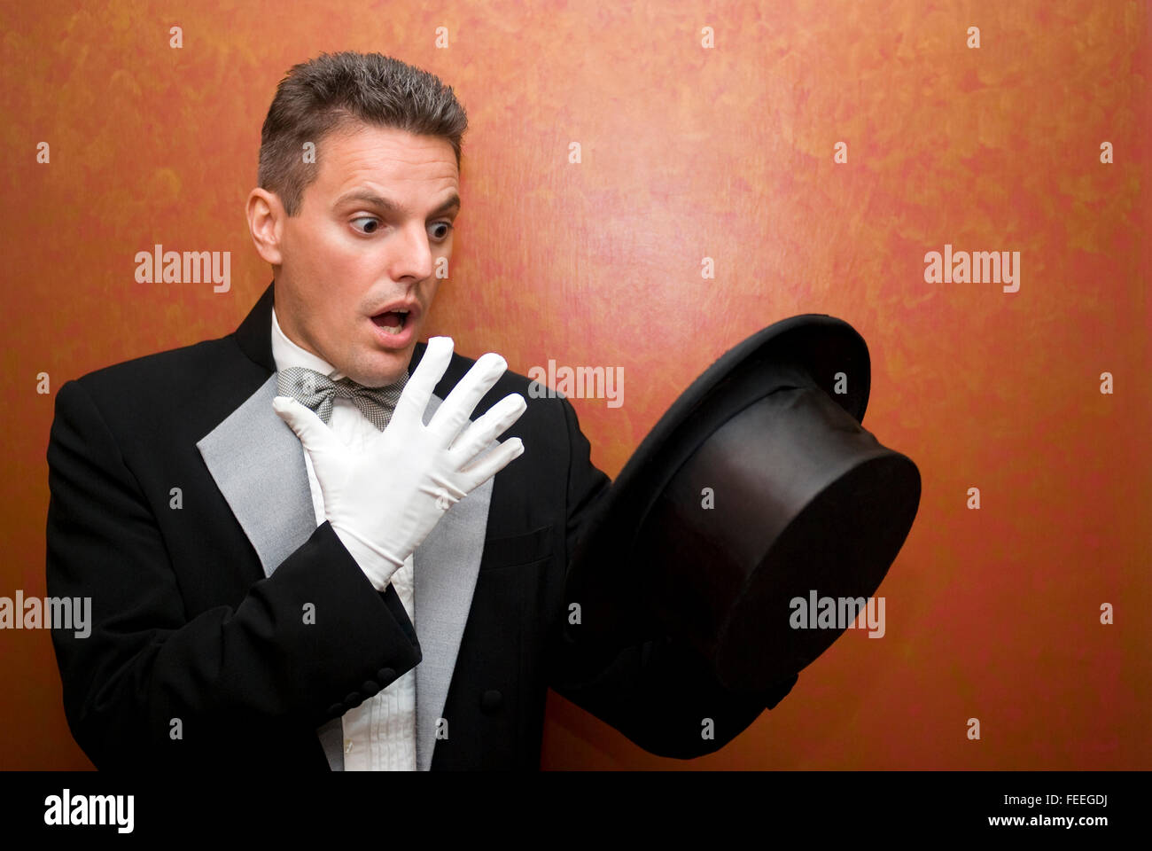 Magician performing a magic trick Stock Photo - Alamy Magician performing a magic trick Stock Photo - Alamy