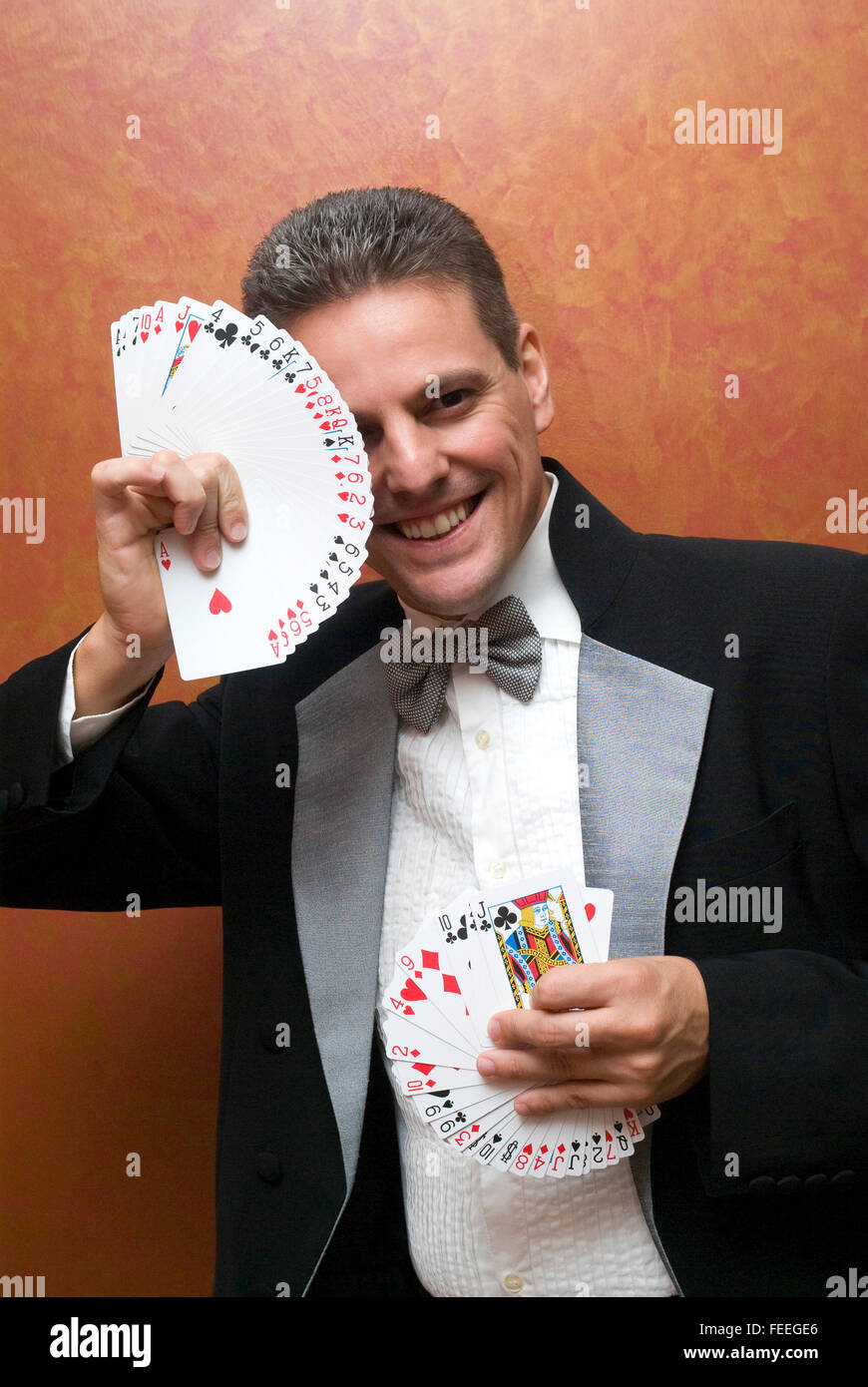 Man showing tricks with cards hi-res stock photography and images - Alamy