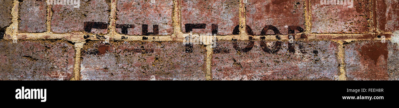 Words 5th floor with vintage writing on brick wall Stock Photo - Alamy
