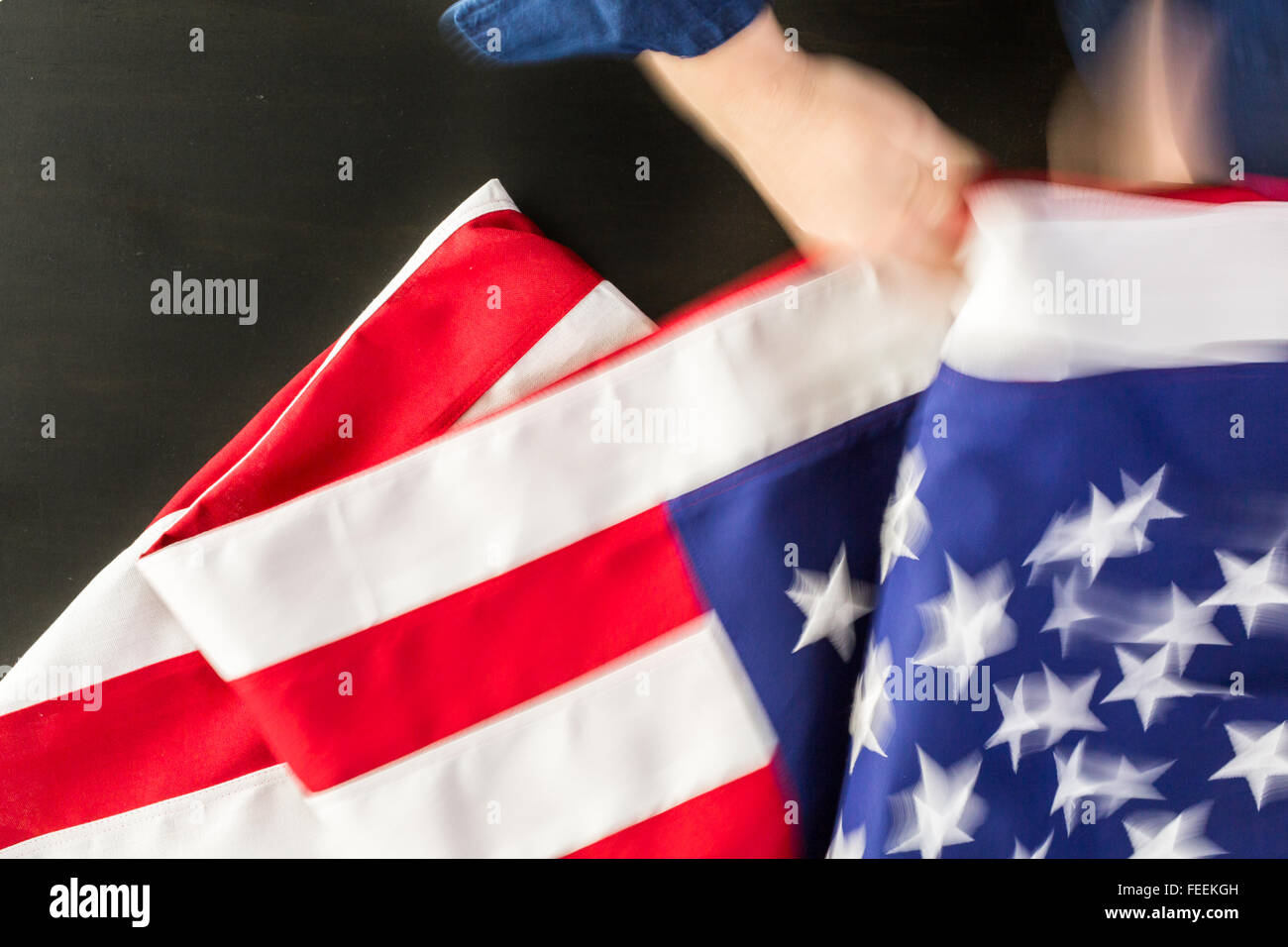 Hands sewing american flag hi-res stock photography and images - Alamy