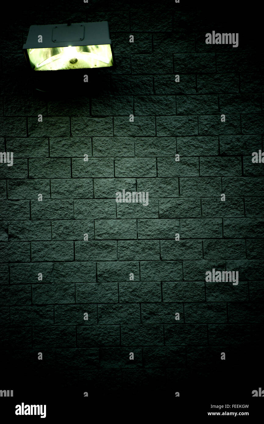 Light on the dark wall Stock Photo - Alamy