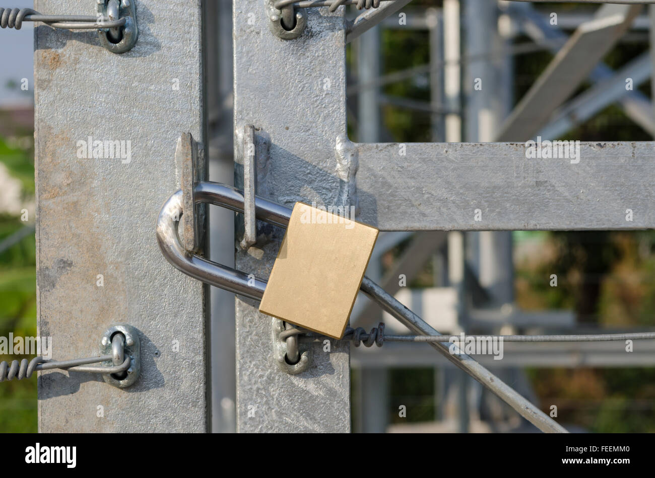 steel door of warehouse is lock with Locked brass keys Stock Photo - Alamy