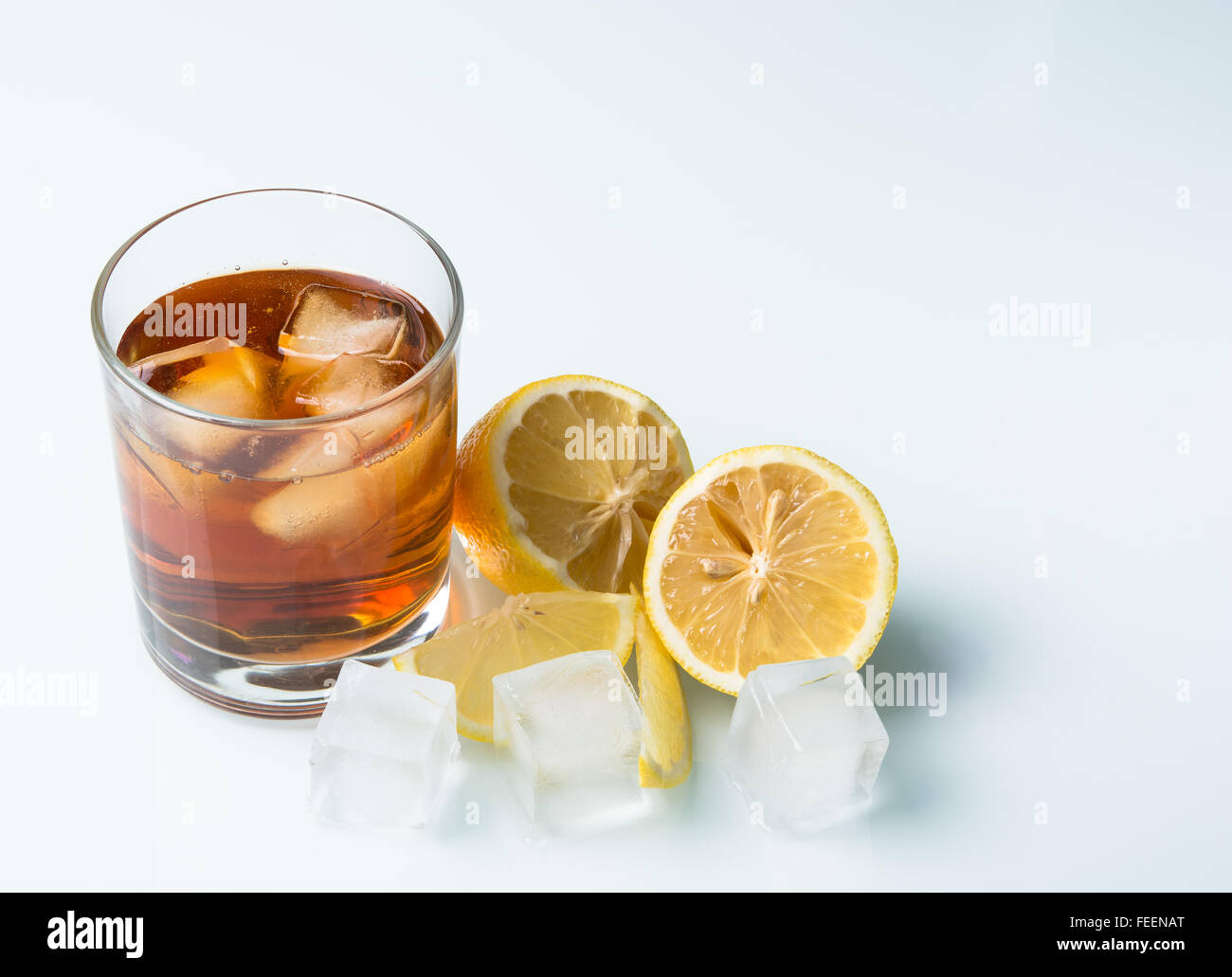 alcohol and ice cubes with lemon Stock Photo - Alamy