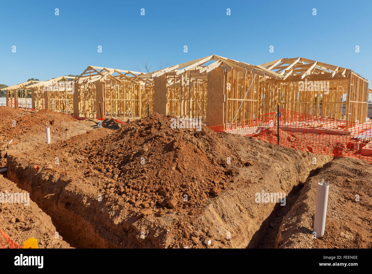 new suburban homes currently under construction in row Stock Photo - Alamy