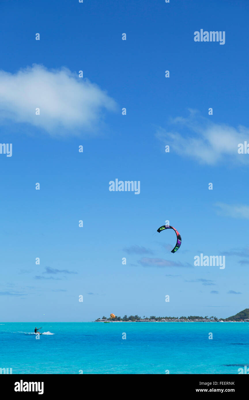 Man kitesurfing in lagoon, Bora Bora, Society Islands, French Polynesia ...