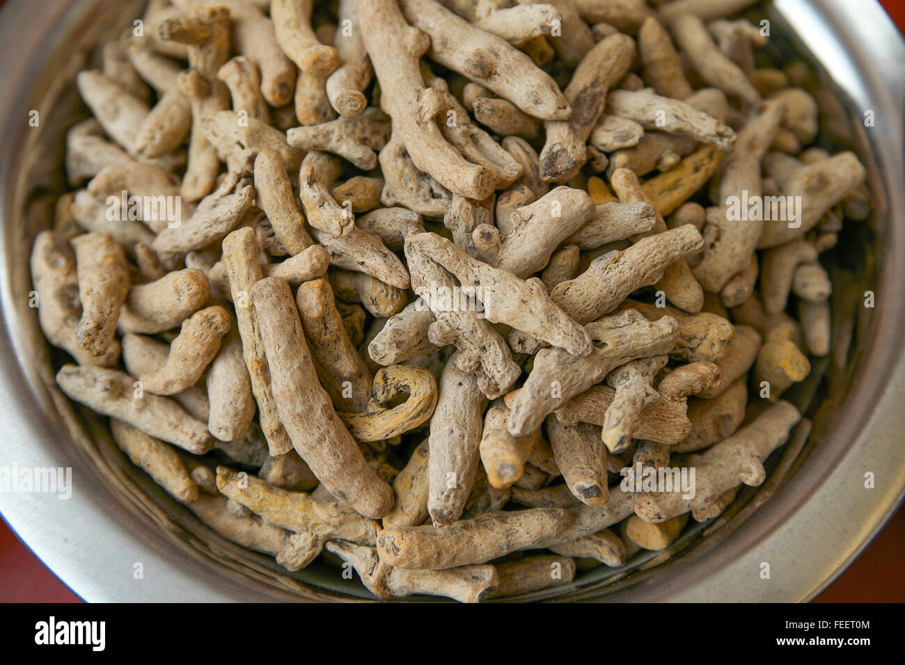 Dried Curcuma Longa or tumeric selling in spice market Stock Photo - Alamy