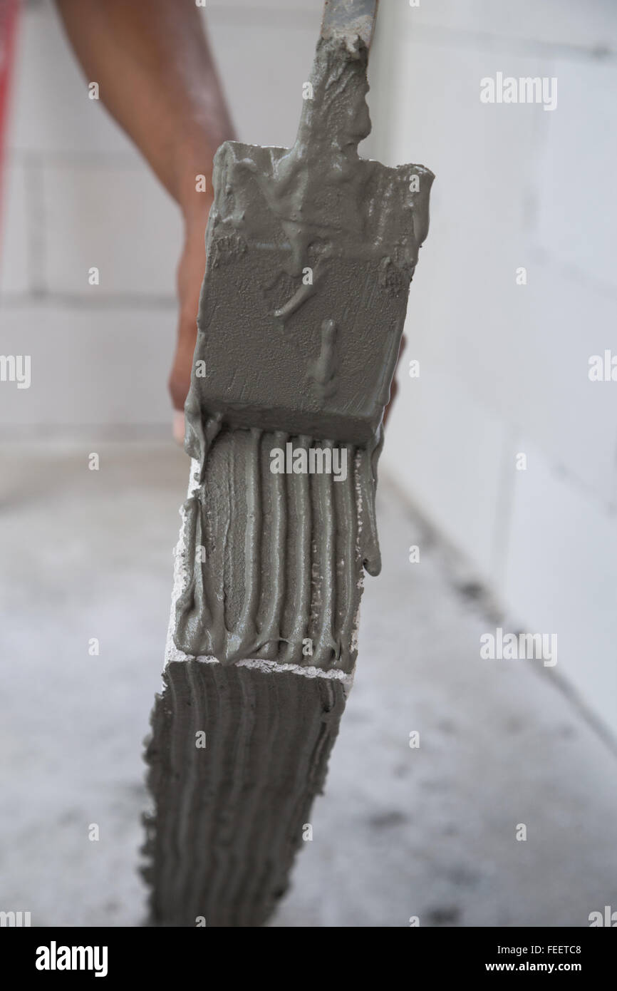 Block wall plaster cement trowel hi-res stock photography and images ...