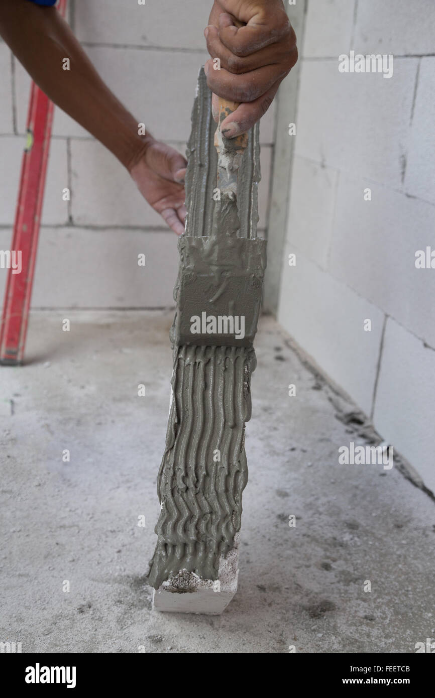 Block wall plaster cement trowel hi-res stock photography and images ...