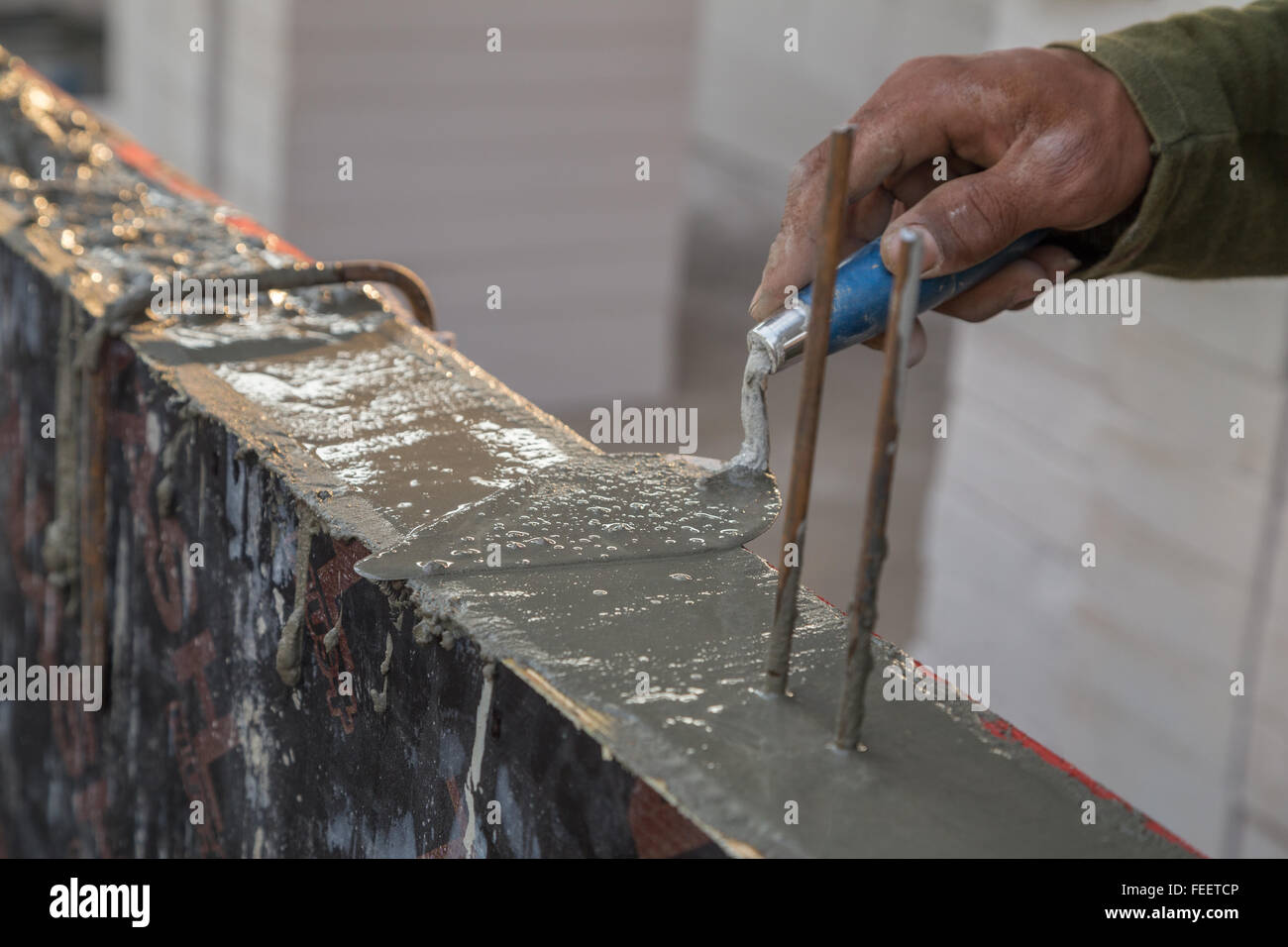 hand using trowel with wet concrete at construction site Stock Photo ...