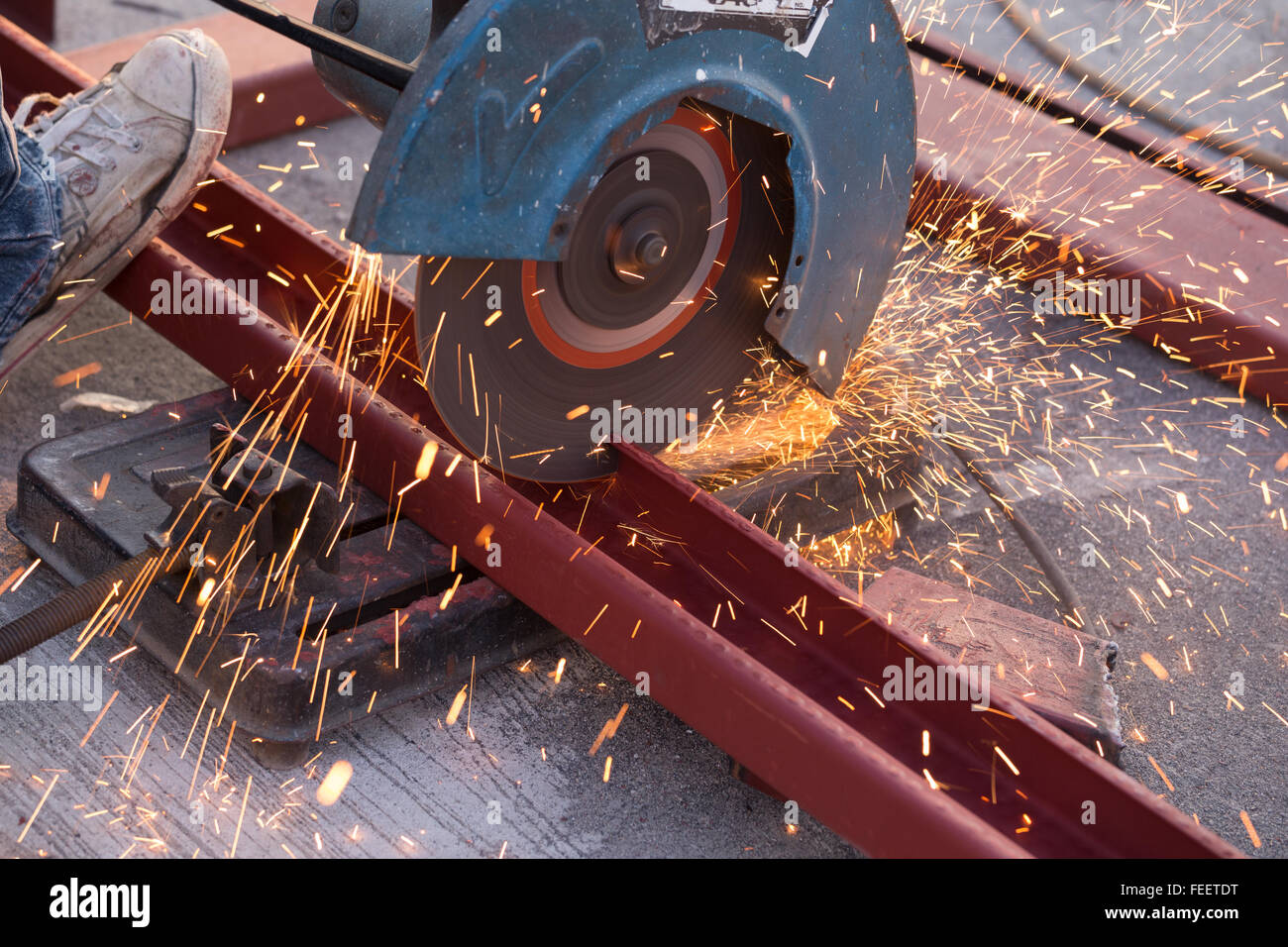 Cutting Steel channel (steel C chanel) with grinder. Sparks while ...