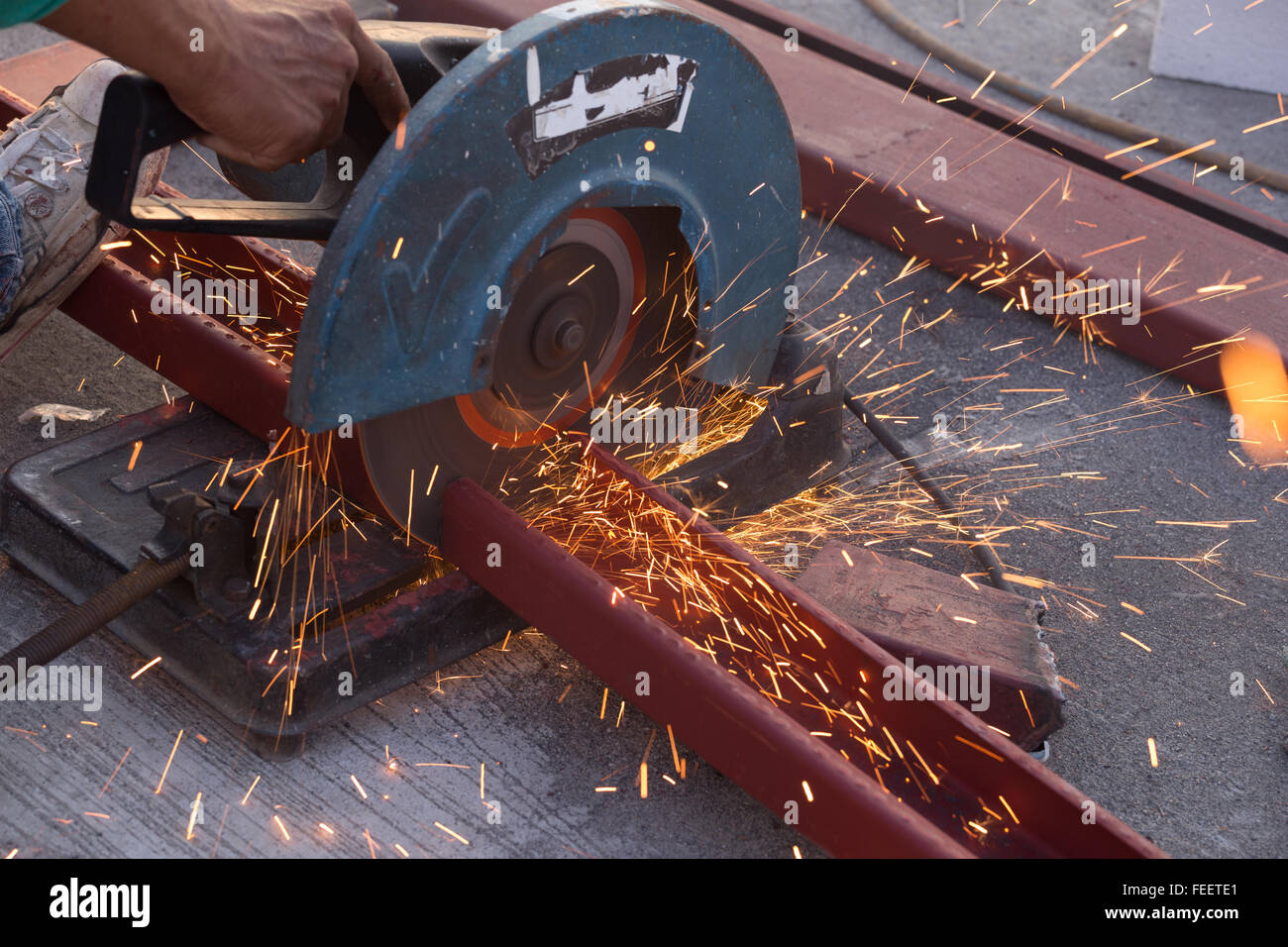 Cutting Steel channel (steel C chanel) with grinder. Sparks while ...