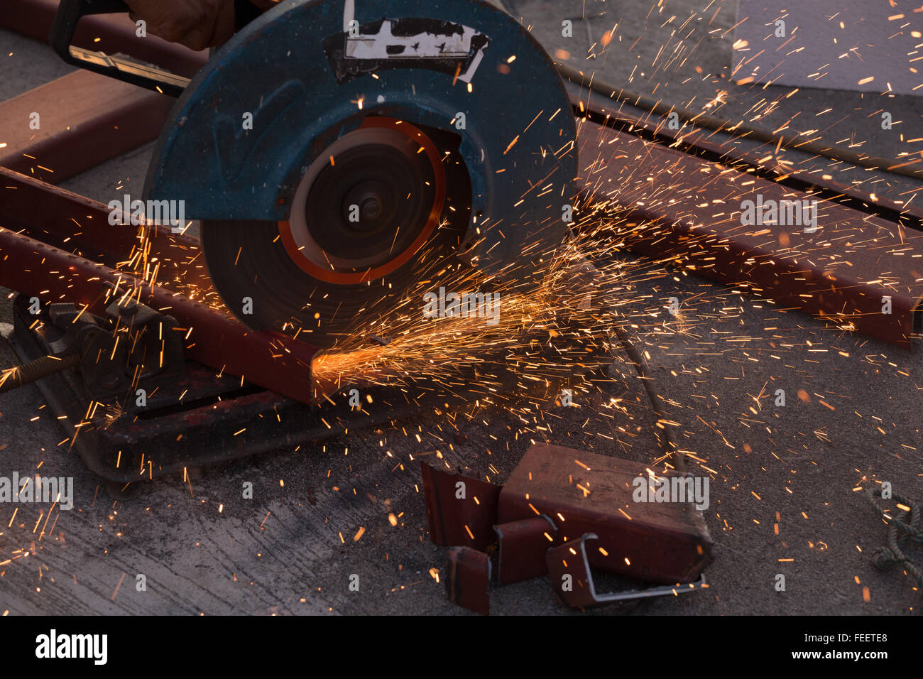 Cutting Steel channel (steel C chanel) with grinder. Sparks while ...