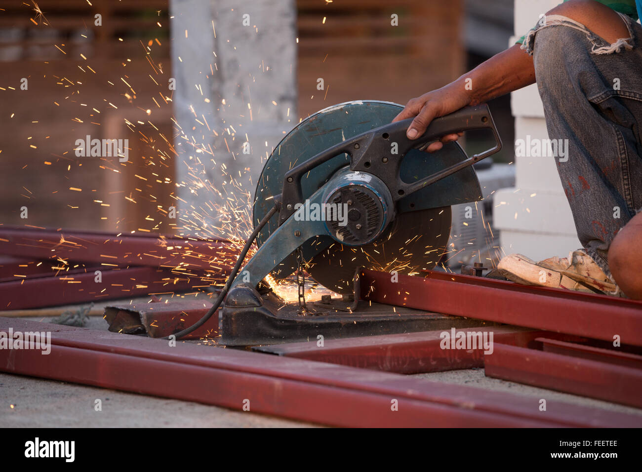 Cutting Steel channel (steel C chanel) with grinder. Sparks while ...