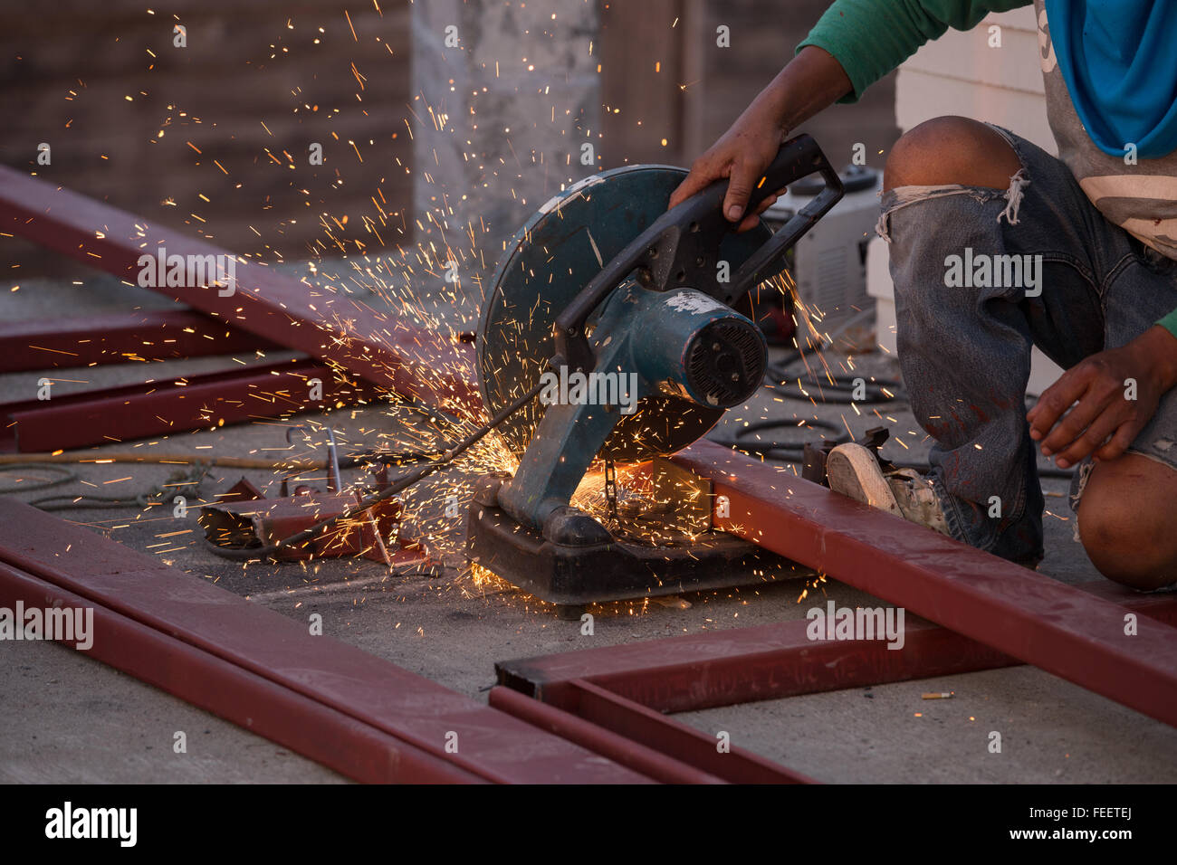 Cutting Steel channel (steel C chanel) with grinder. Sparks while ...