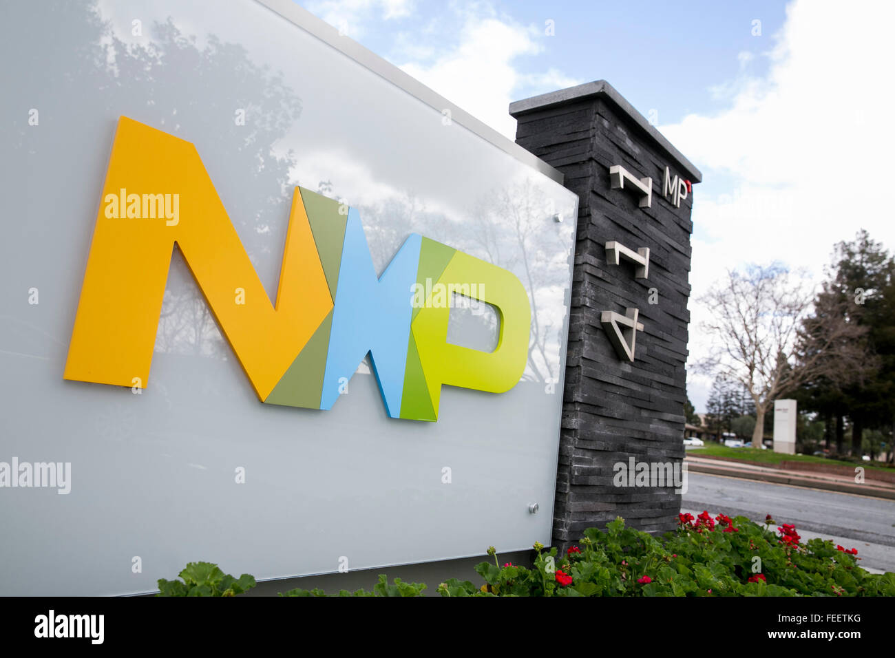 A logo sign outside of a facility occupied by NXP Semiconductors in San ...
