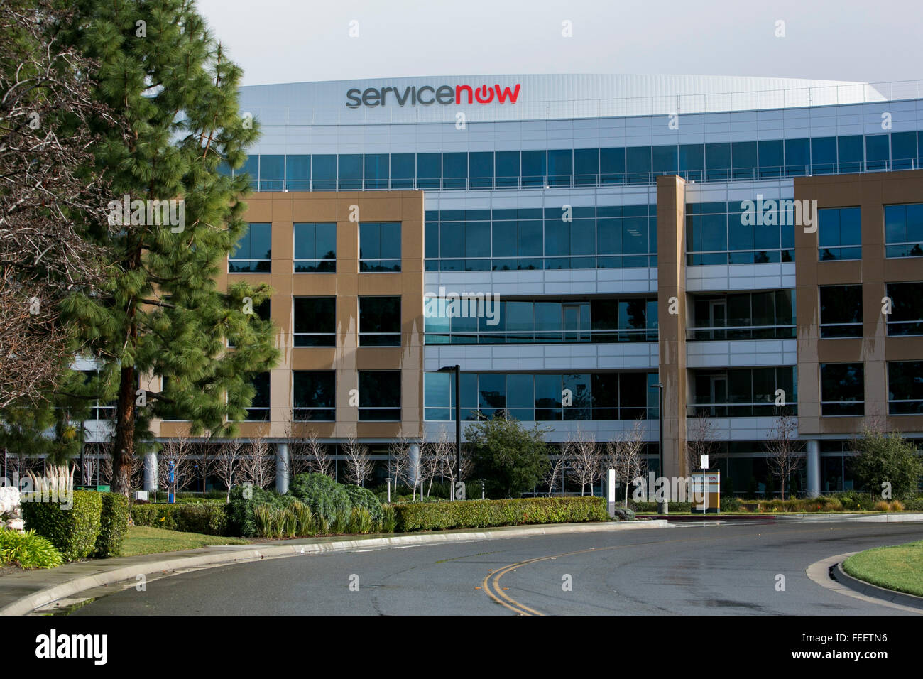 A logo sign outside of the headquarters of ServiceNow in Santa Clara ...