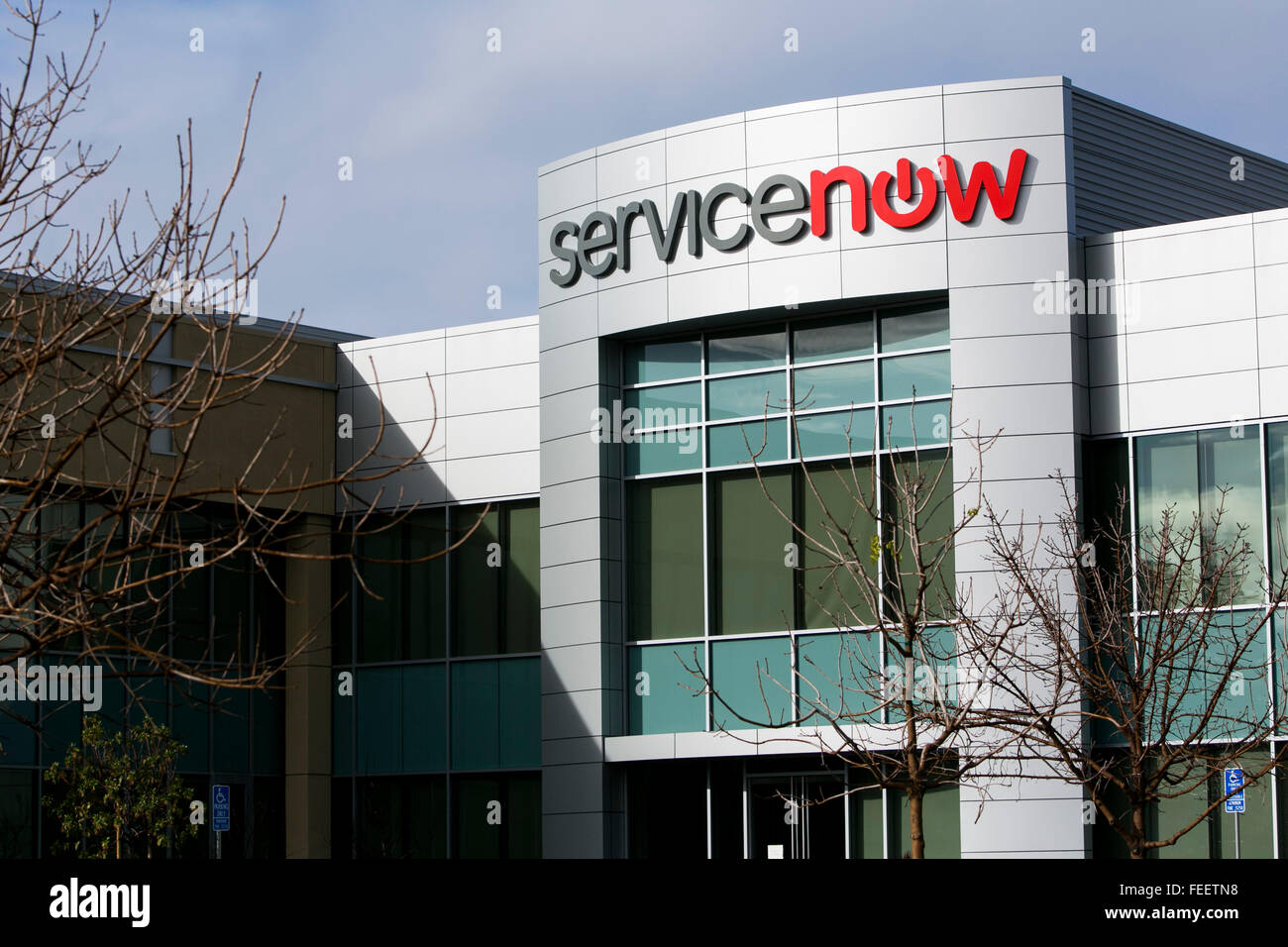A logo sign outside of the headquarters of ServiceNow in Santa Clara ...