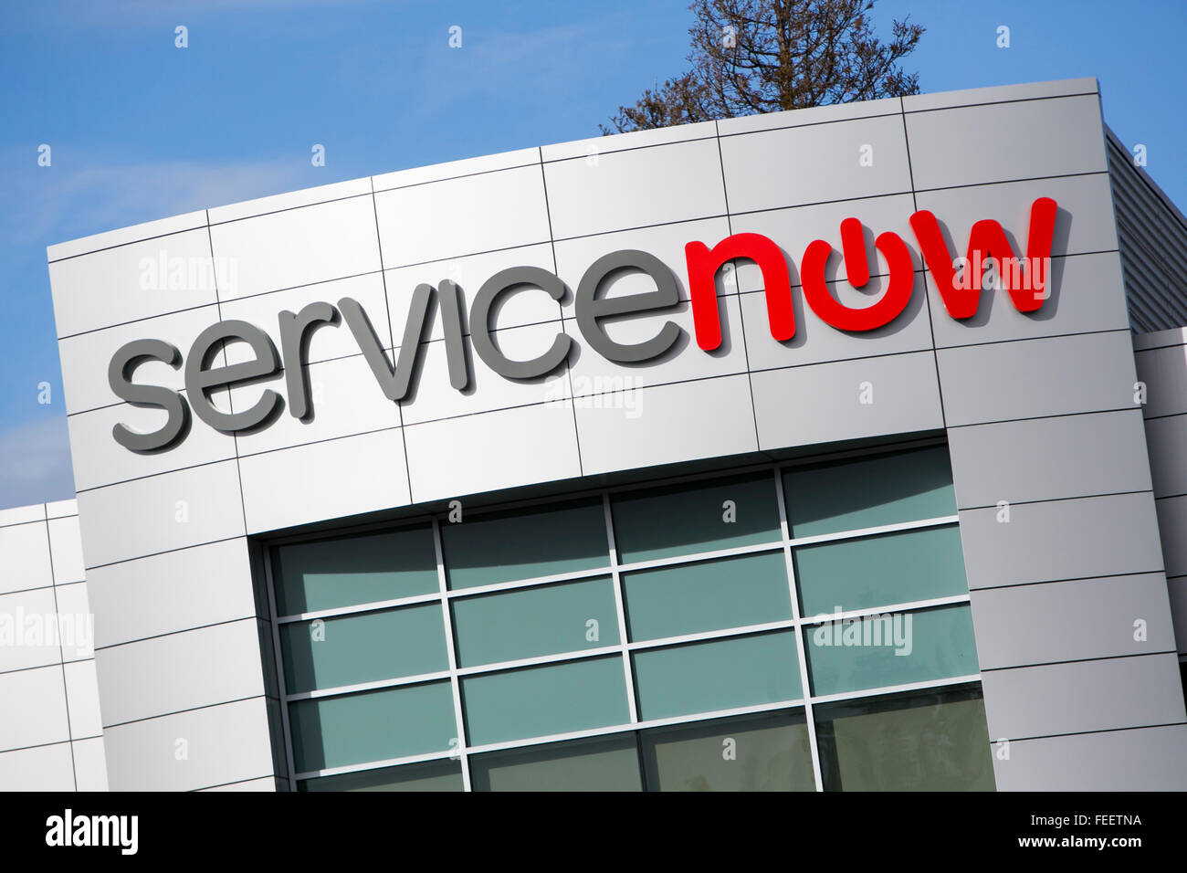 A logo sign outside of the headquarters of ServiceNow in Santa Clara ...