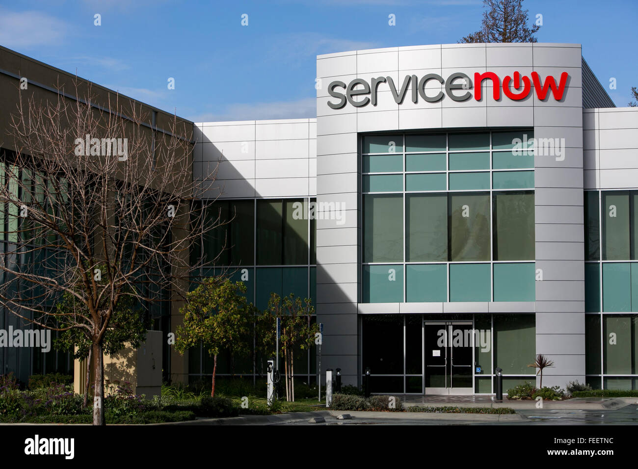 A logo sign outside of the headquarters of ServiceNow in Santa Clara ...