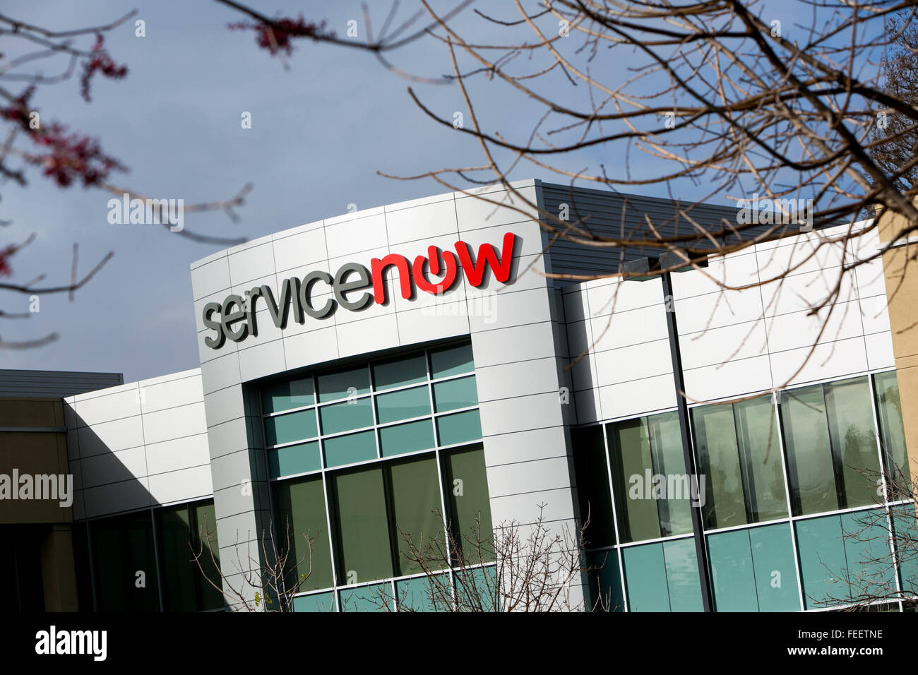 A logo sign outside of the headquarters of ServiceNow in Santa Clara ...