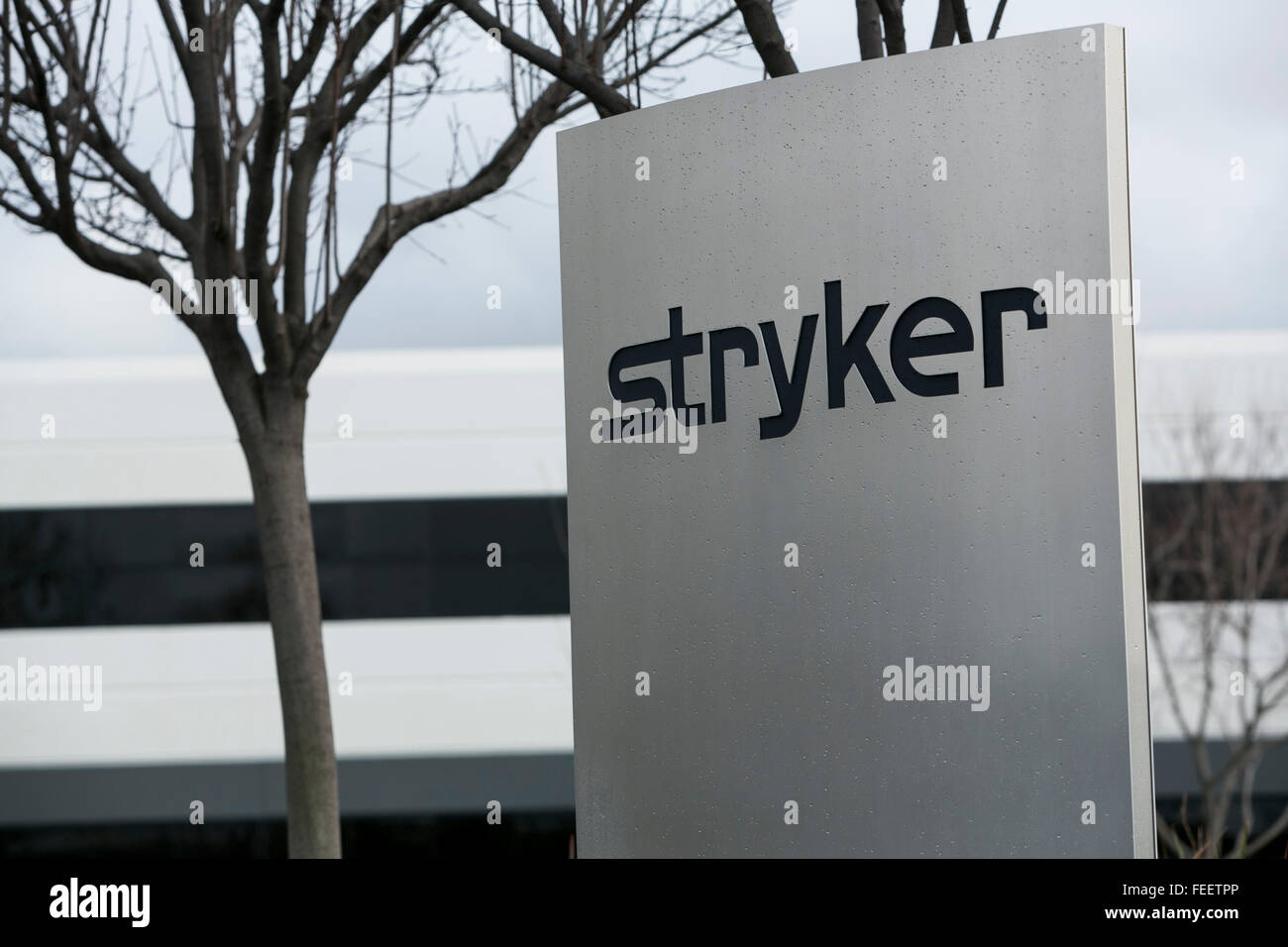 A logo sign outside of a facility occupied by the Stryker Corporation ...