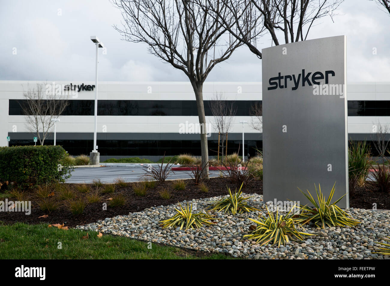 A logo sign outside of a facility occupied by the Stryker Corporation ...