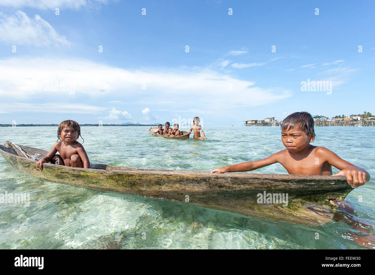 Borneo Sea Gypsy kids on a canoes in Omadal Island, Sabah Borneo ...