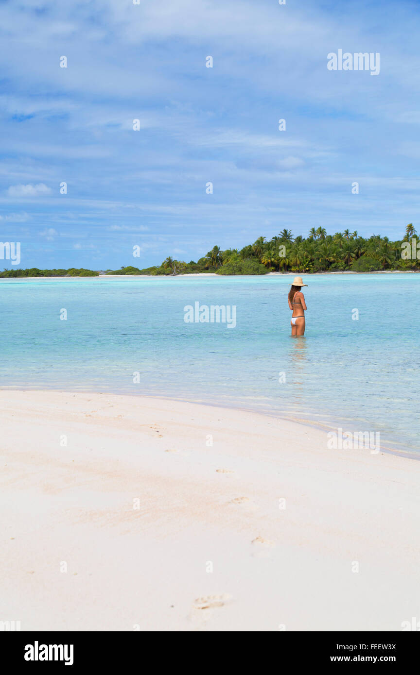 Woman on beach at Les Sables Roses (Pink Sands), Tetamanu, Fakarava ...