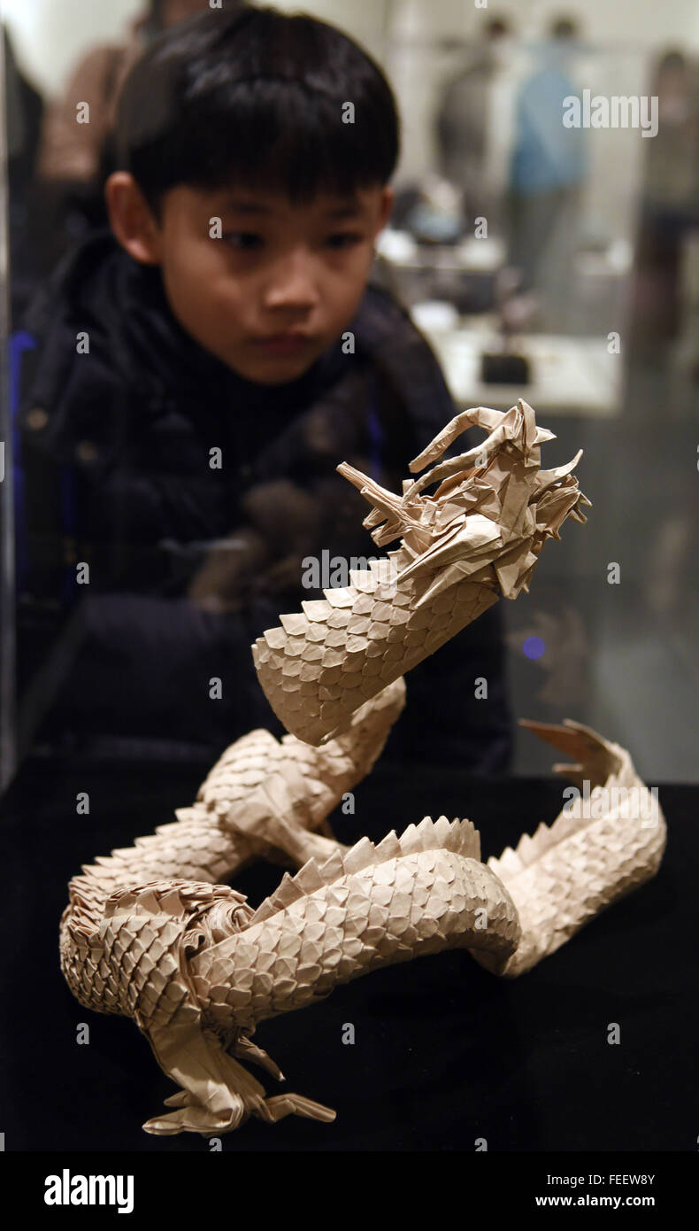 Taipei's Taiwan. 5th Feb, 2016. A boy looks at an origami artwork ...