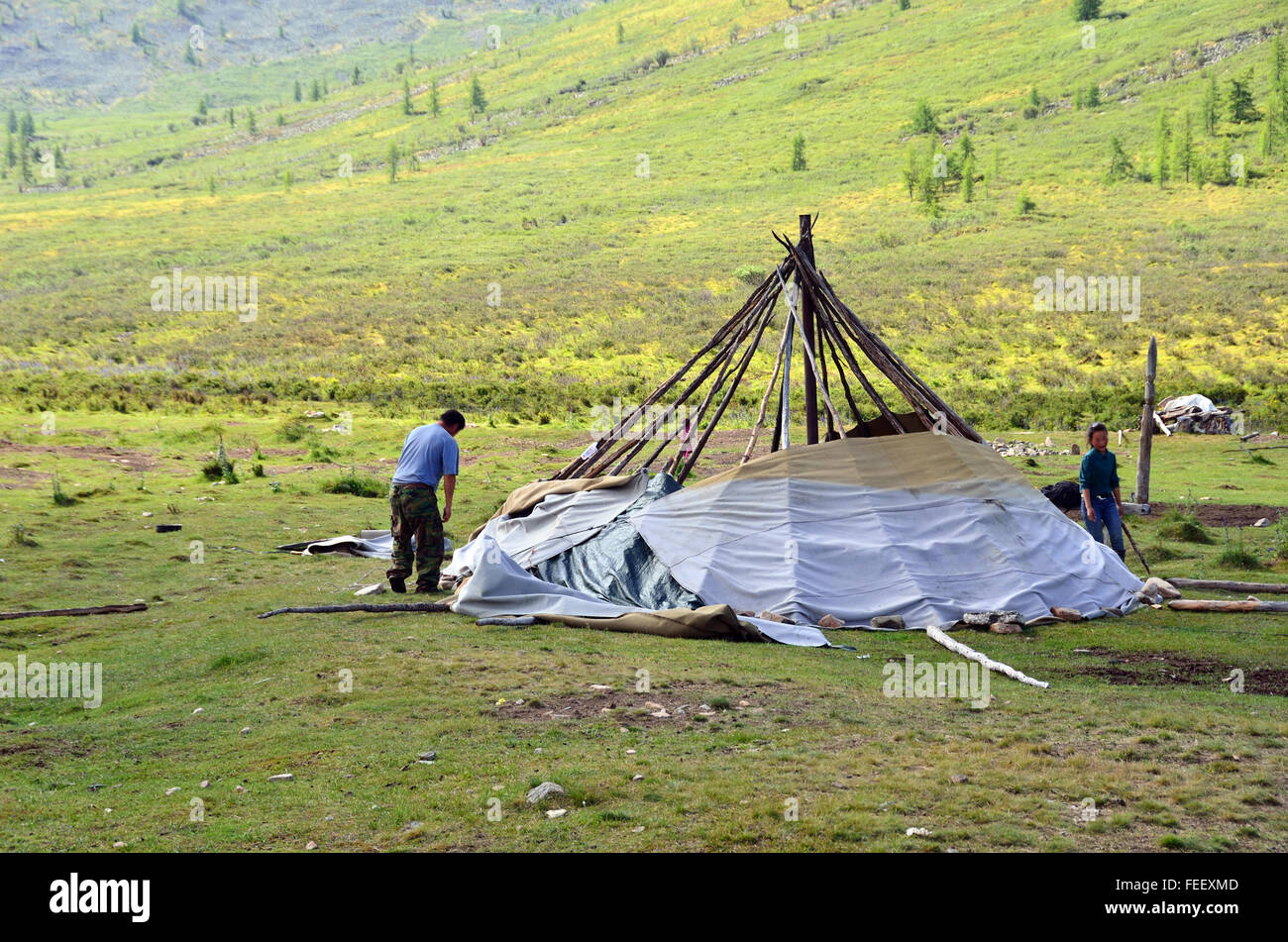 Duhkha (same as Tsaatan) people putting down their tent Stock Photo - Alamy