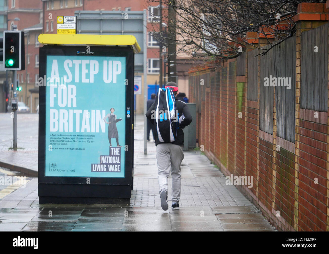 A bus stop in the city advertising the National Living Wage Stock Photo ...