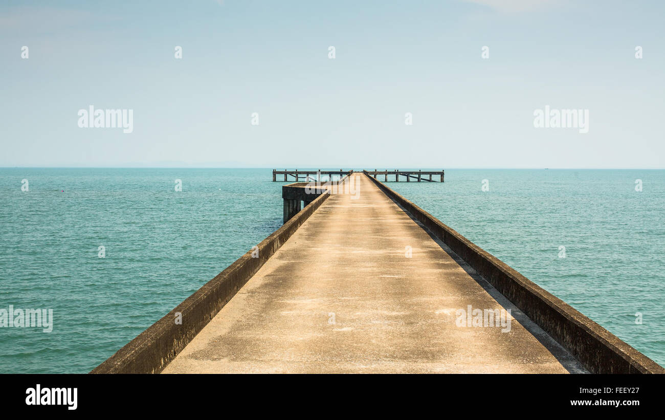 Stone Pier stretching into the Sea Stock Photo - Alamy