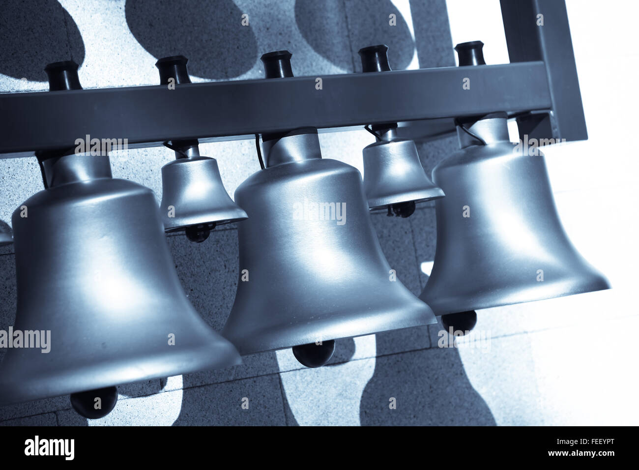 Color image of some various sized bells in a row Stock Photo - Alamy