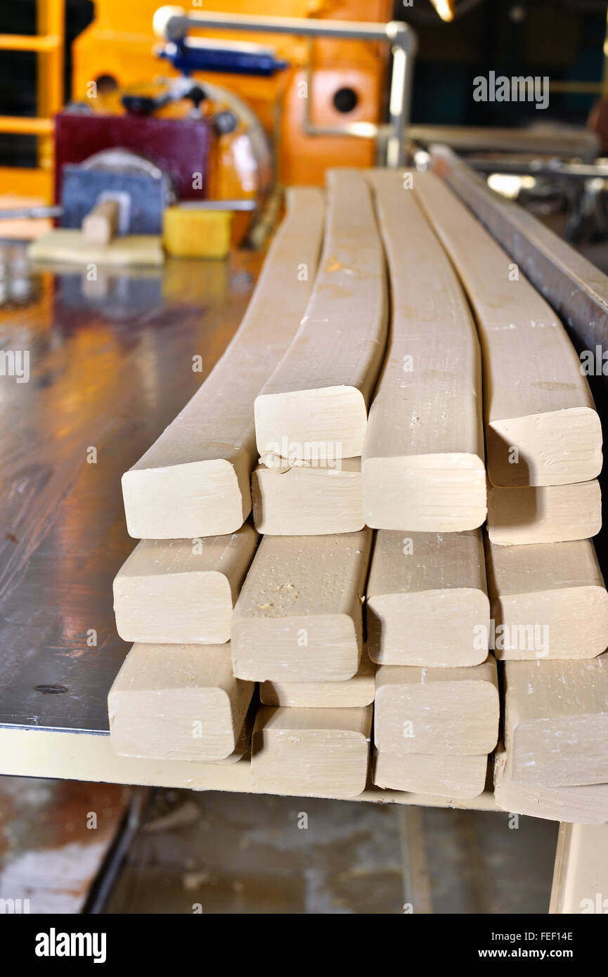 Pieces of soap on the assembly line at the plant for the production of ...