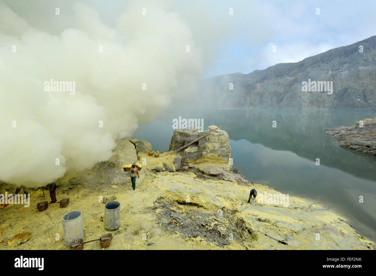 People collecting sulfur from the crater of the volcano Ijen on the ...