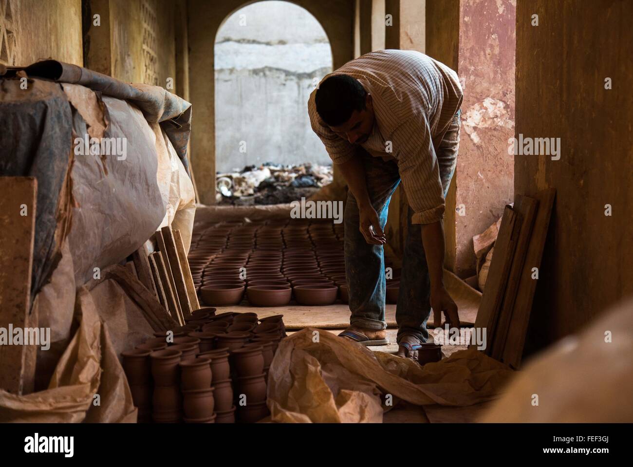 Cairo, Egypt. 2nd Feb, 2016. An Egyptian man works at a pottery ...