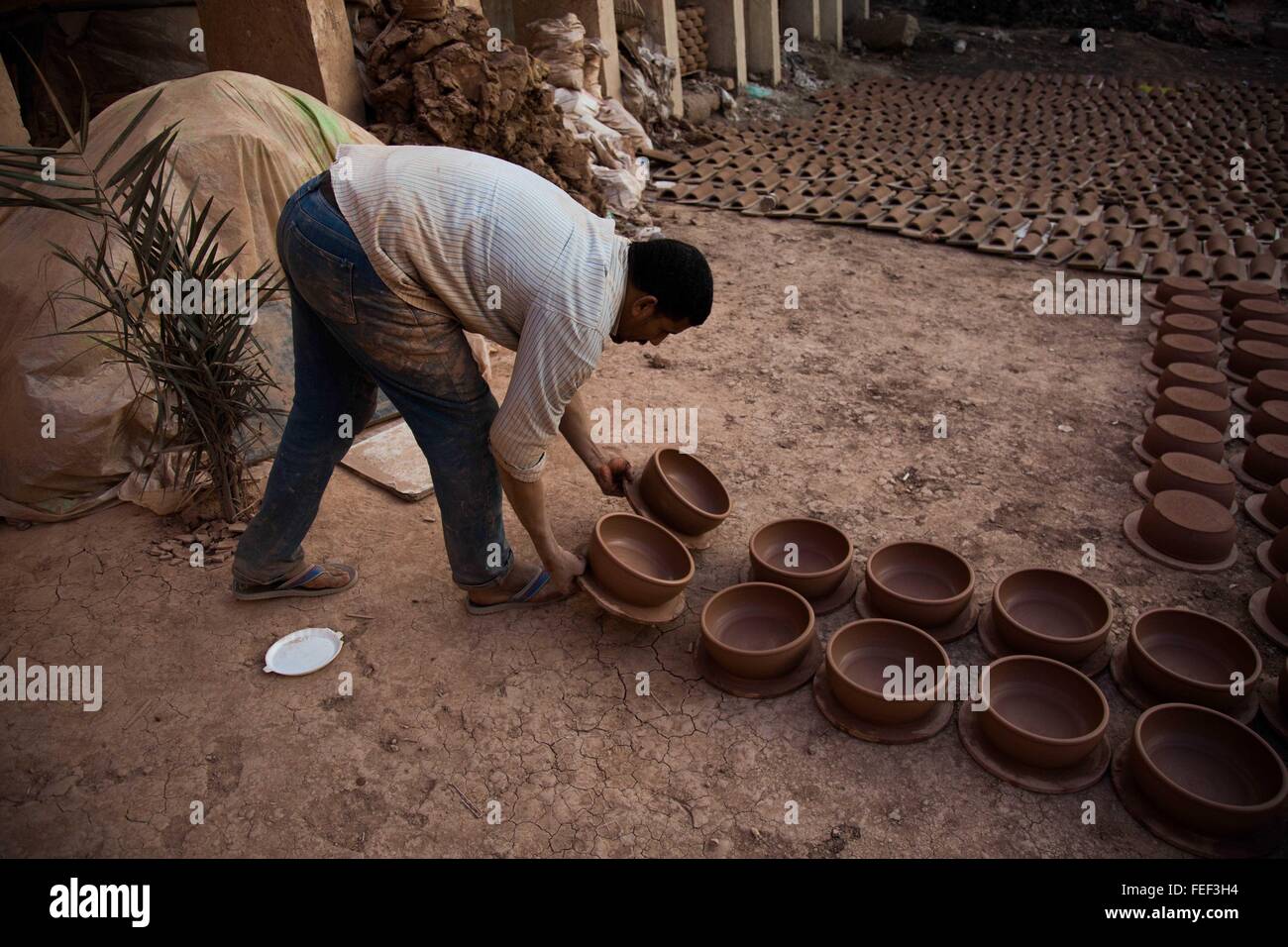 Cairo, Egypt. 2nd Feb, 2016. An Egyptian man works at a pottery ...