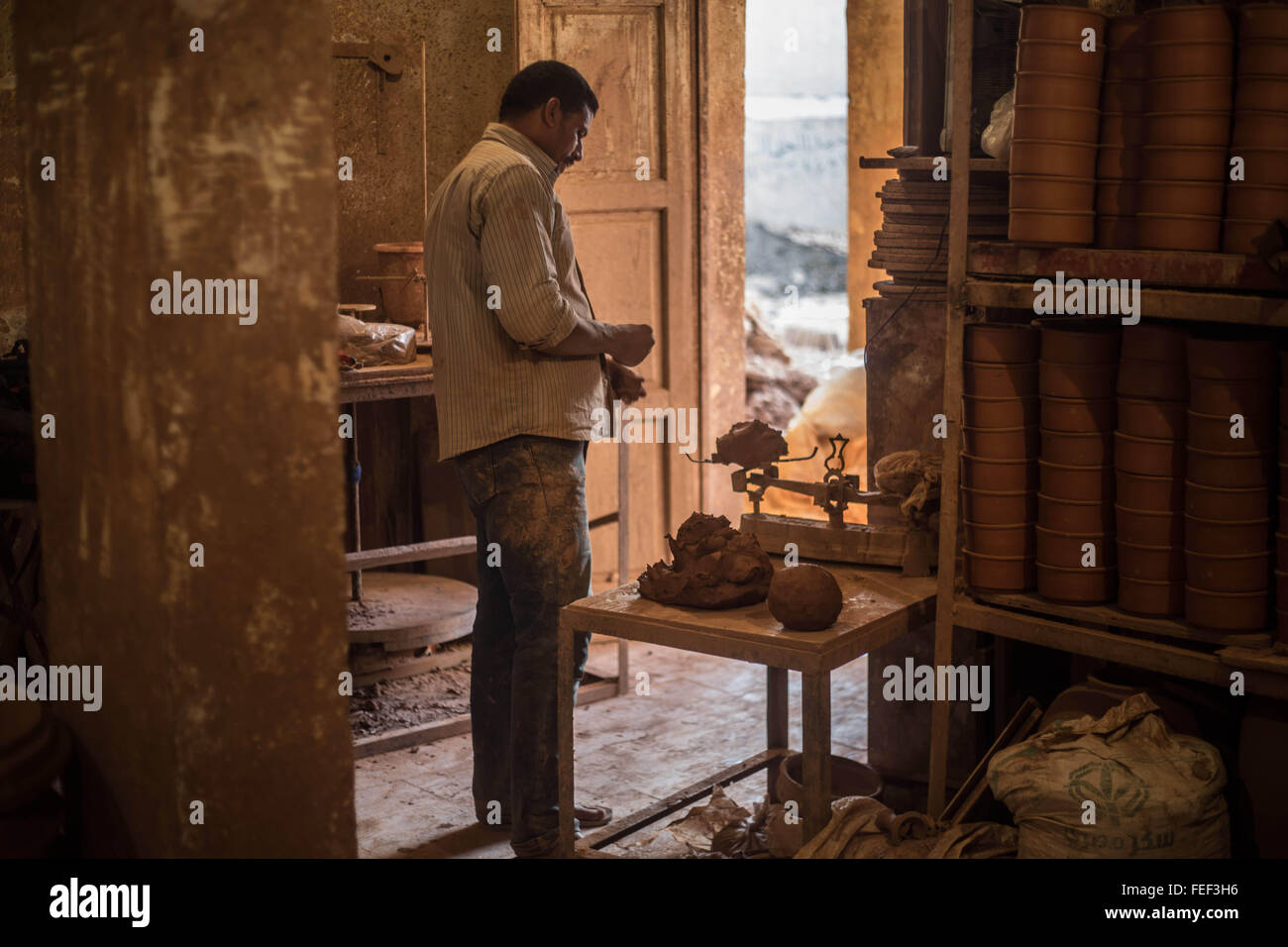 Cairo, Egypt. 2nd Feb, 2016. An Egyptian man works at a pottery ...